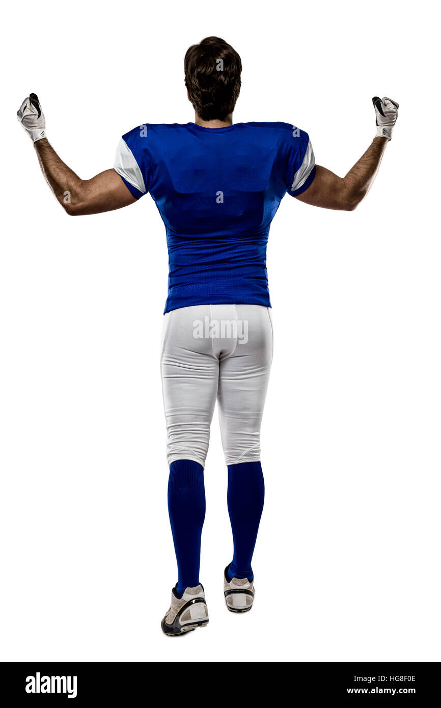Football Player with a blue uniform walking, showing his back on a ...