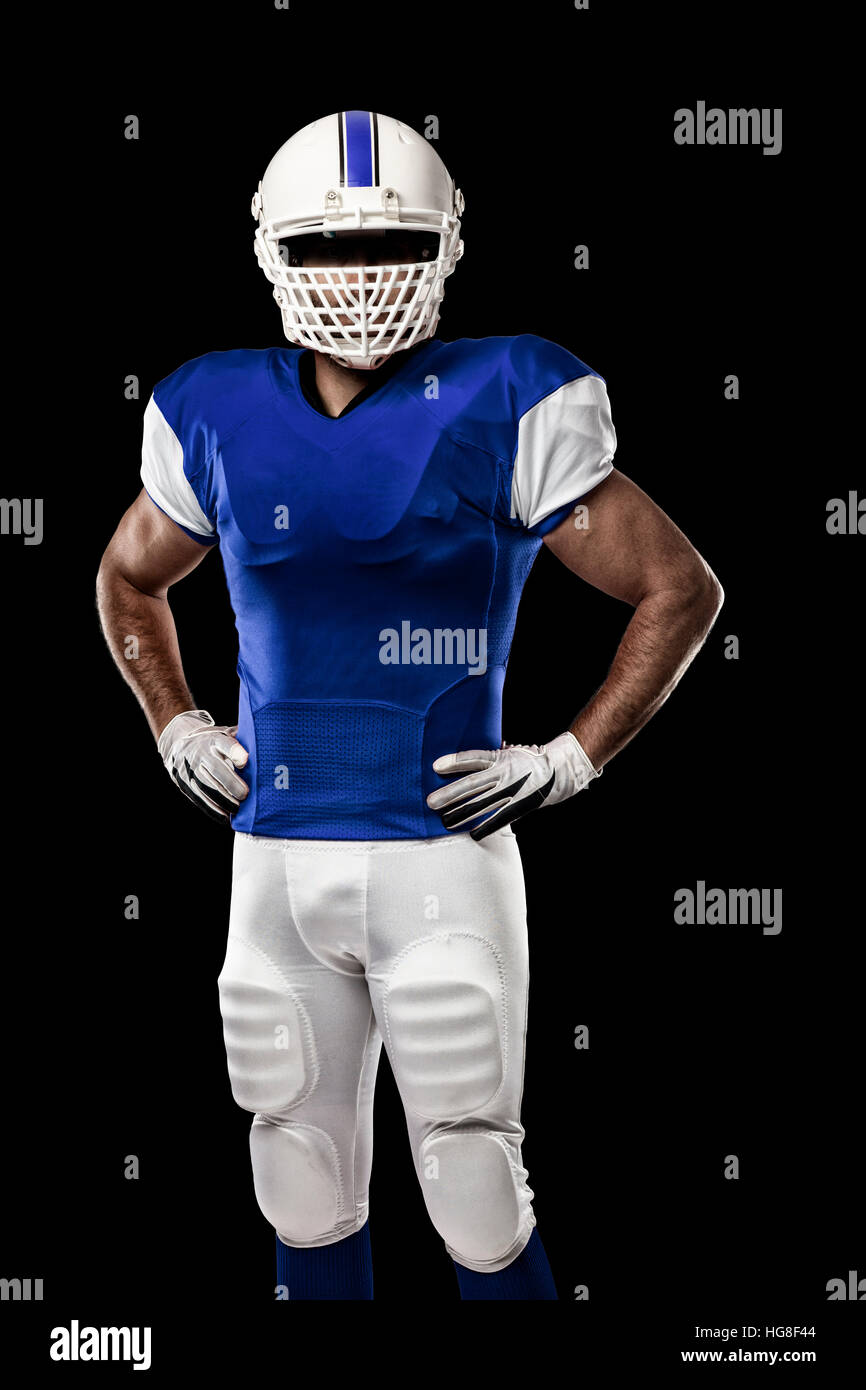 Football Player with a blue uniform on a black background Stock Photo ...