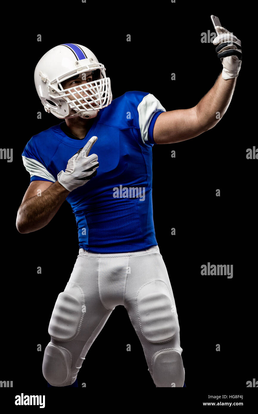Football Player with a blue uniform making a selfie on a black ...