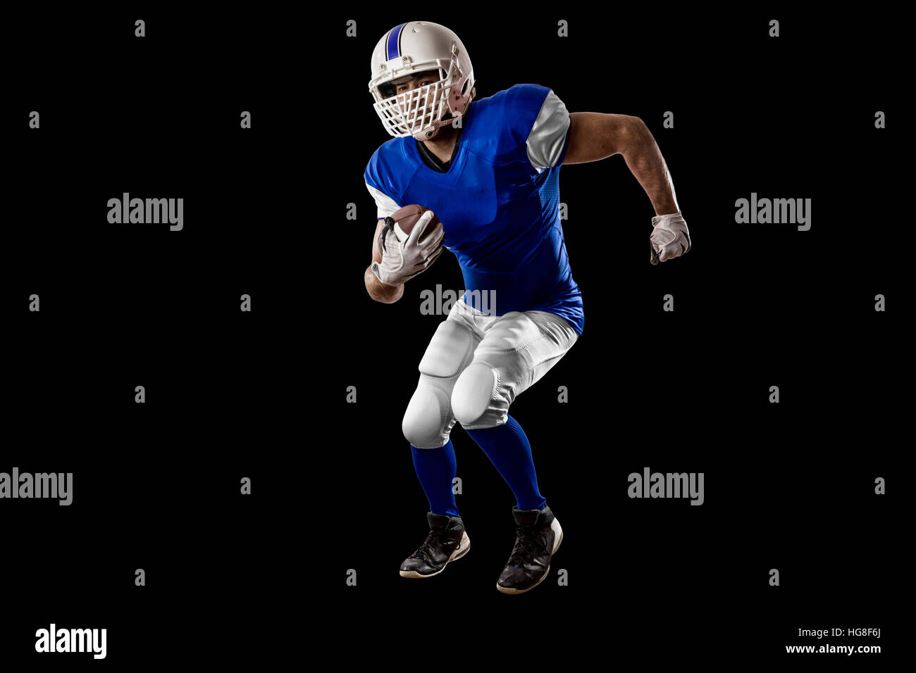 Football Player with a blue uniform Running on a black background Stock ...