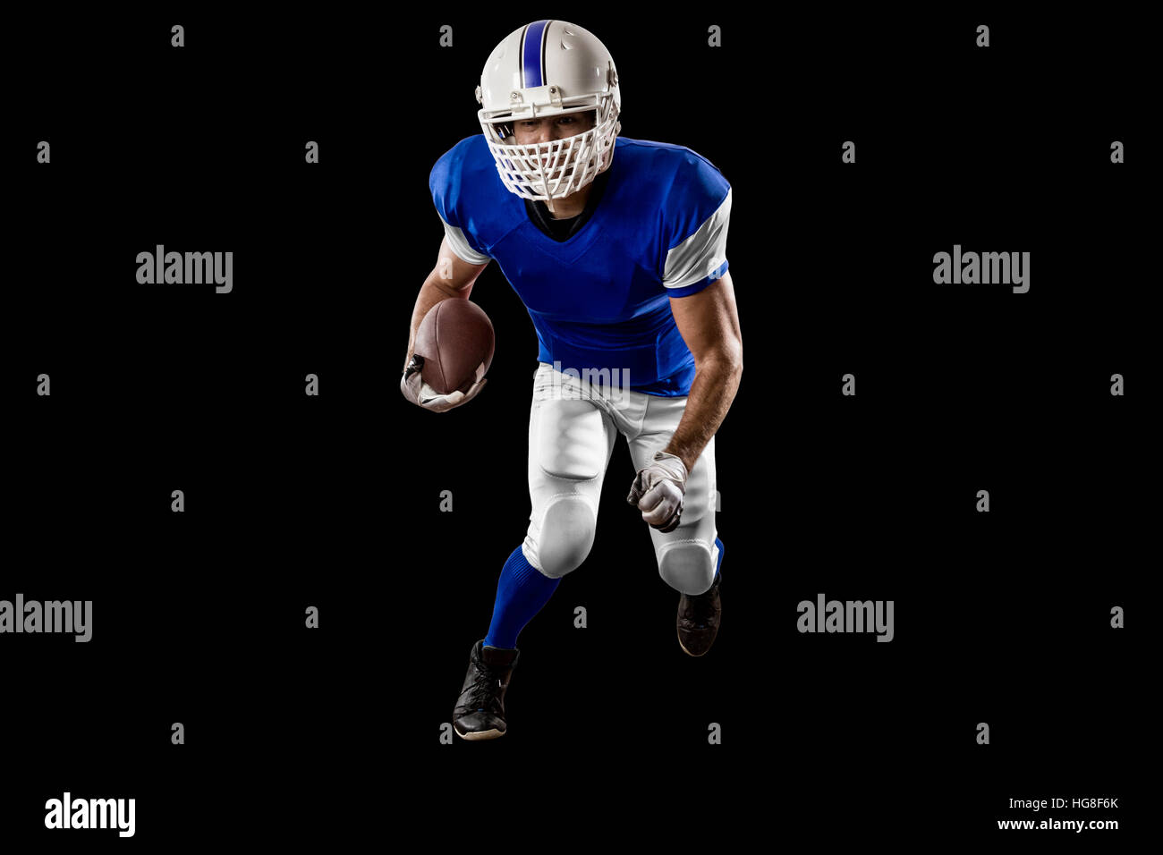 Football Player with a blue uniform Running on a black background Stock ...