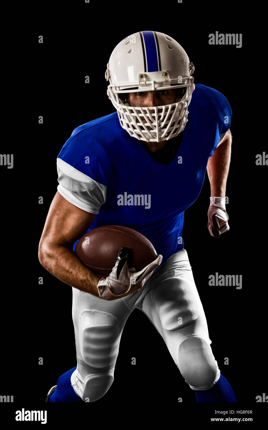 Football Player with a blue uniform Running on a black background Stock ...
