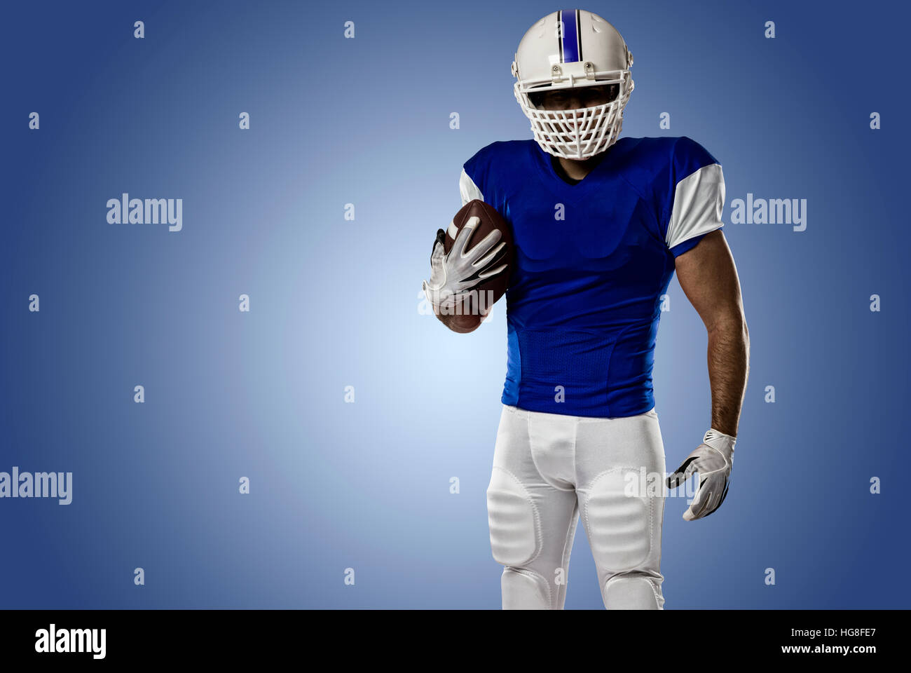 Football Player with a blue uniform on a blue background Stock Photo ...