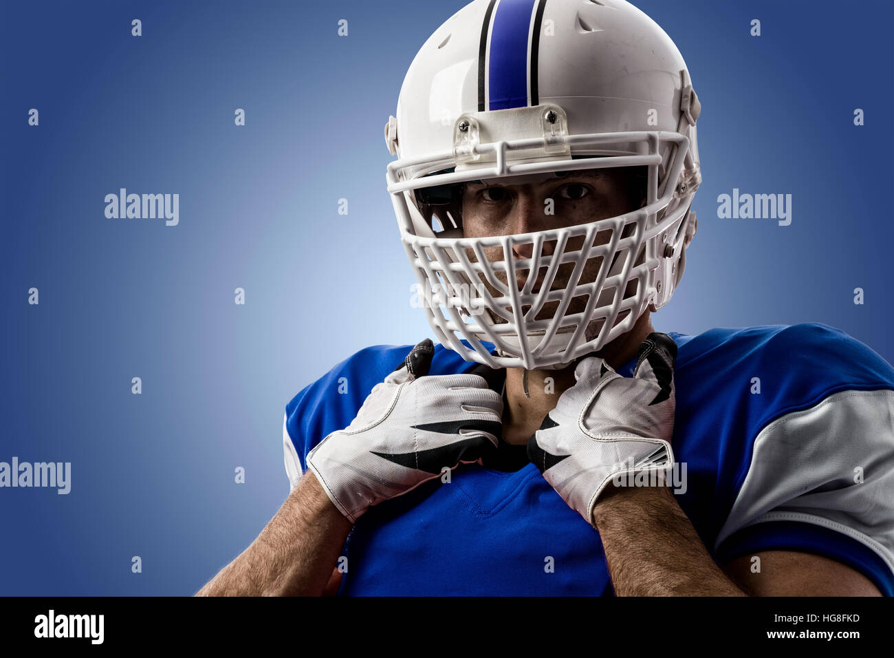 Football Player with a blue uniform on a blue background Stock Photo ...