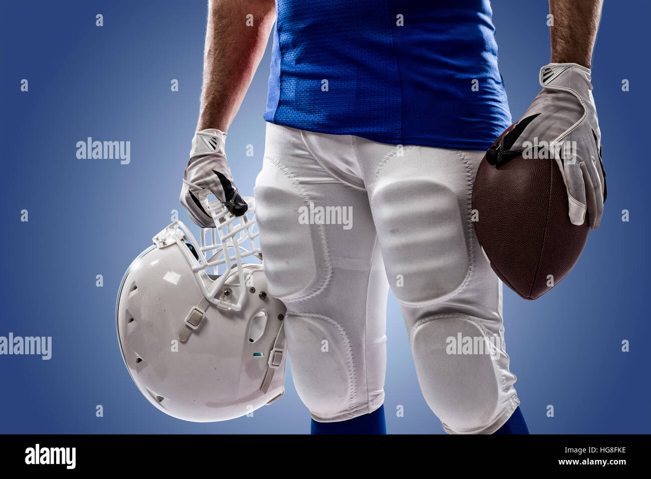 Football Player with a blue uniform on a blue background Stock Photo ...