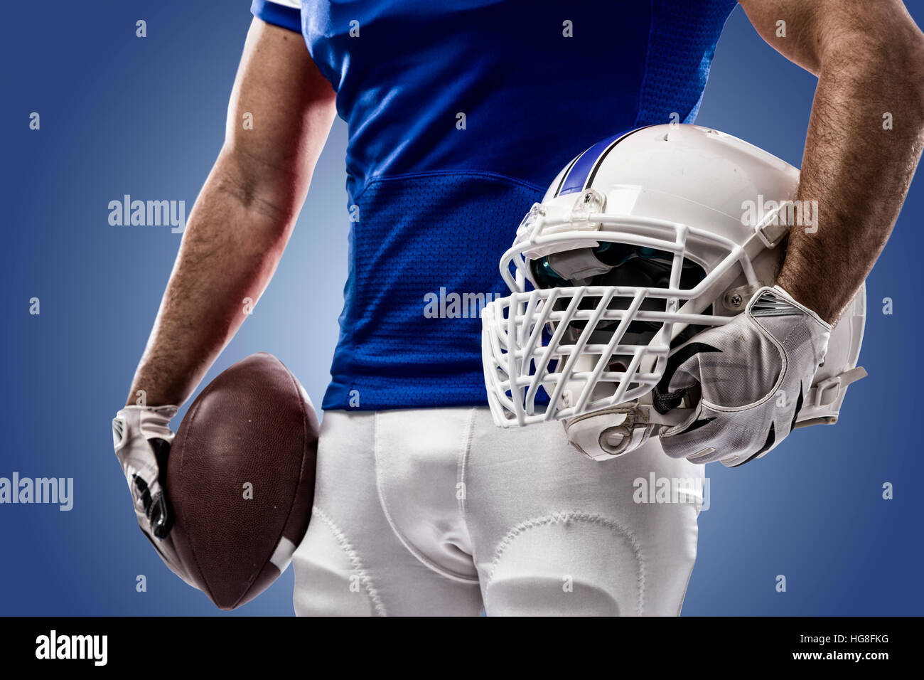 Football Player with a blue uniform on a blue background Stock Photo ...