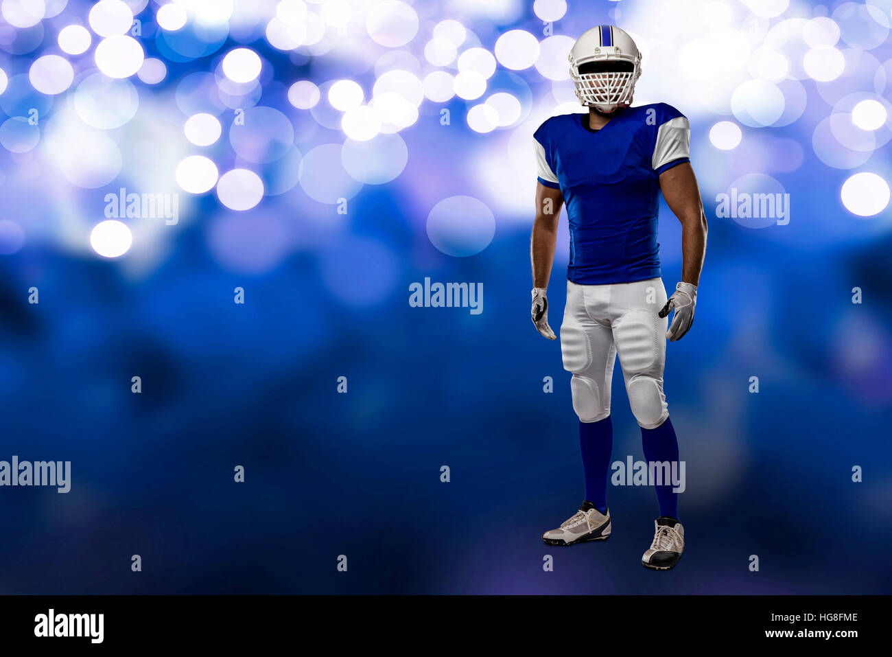 Football Player with a blue uniform on a blue lights background Stock ...