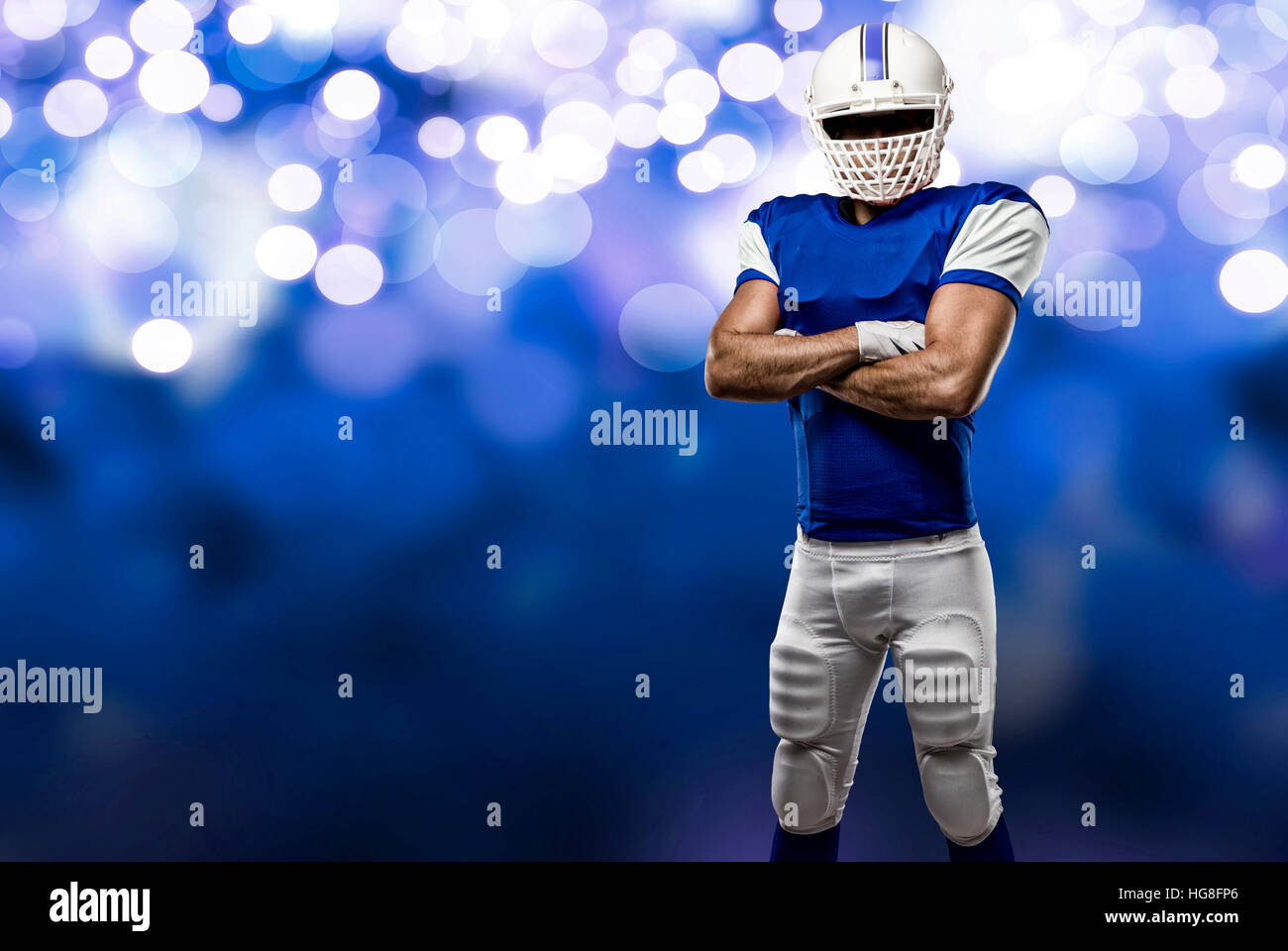 Football Player with a blue uniform on a blue lights background Stock ...