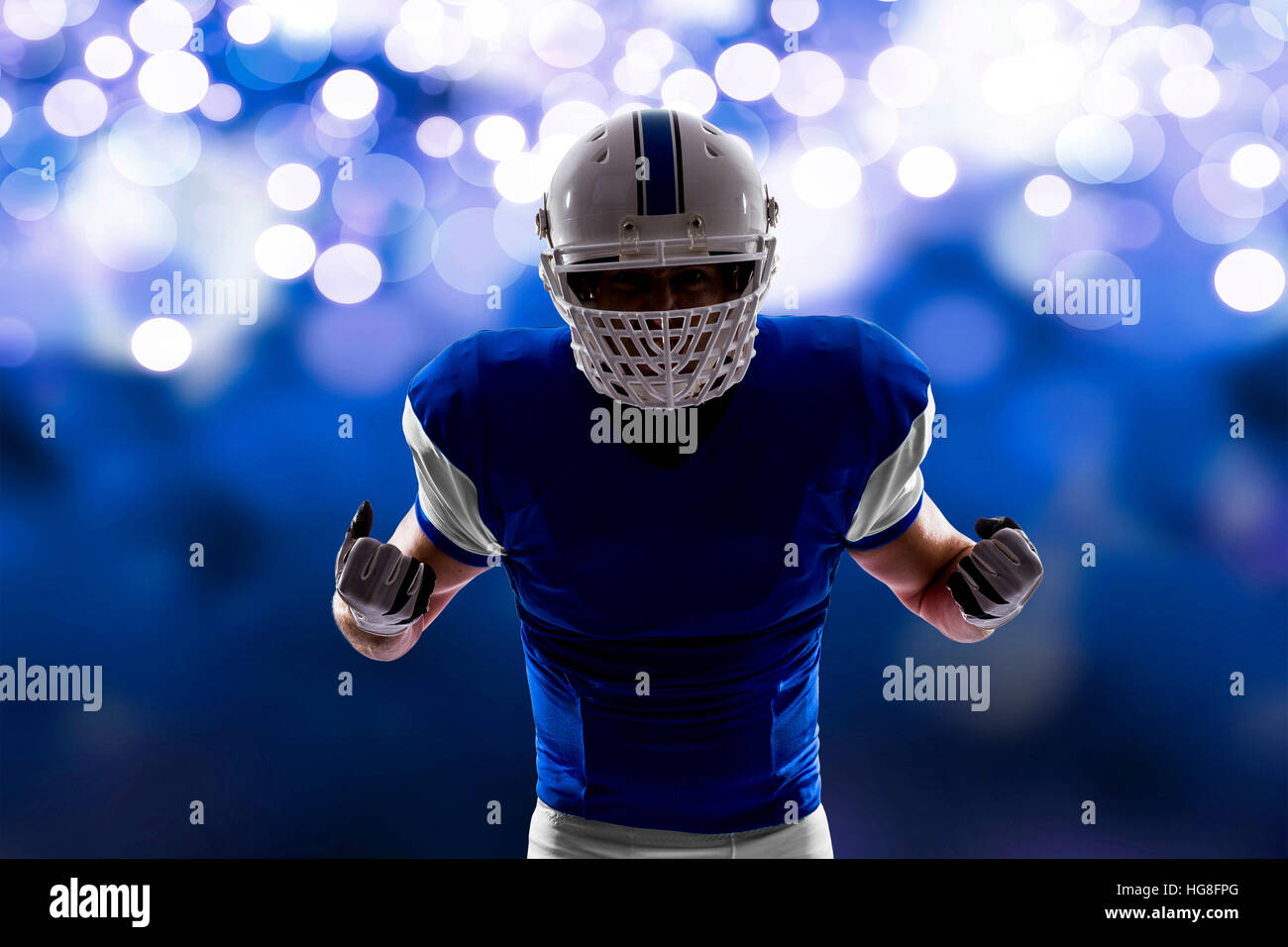 Football Player with a blue uniform on a blue lights background Stock ...