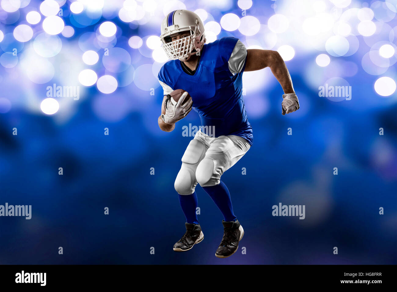 Football Player with a blue uniform Running on a blue lights background ...