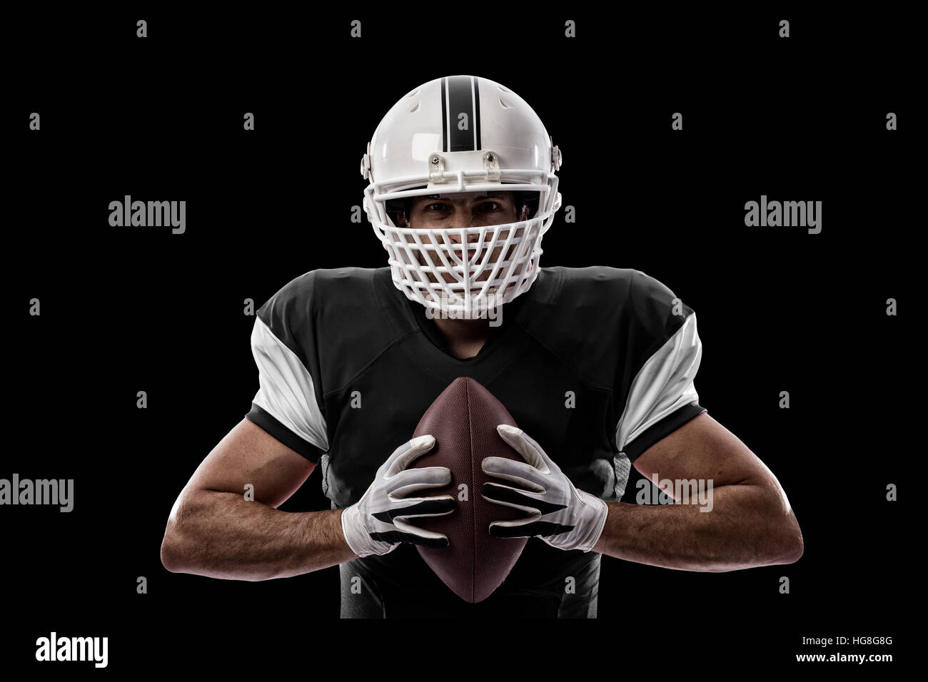 Football Player with a Black uniform on a black background Stock Photo ...