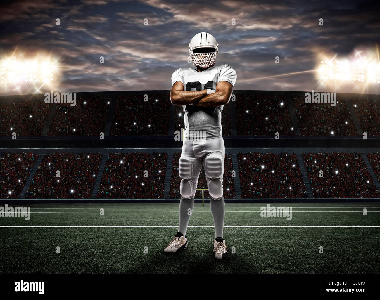 Football Player with a white uniform on a stadium Stock Photo - Alamy