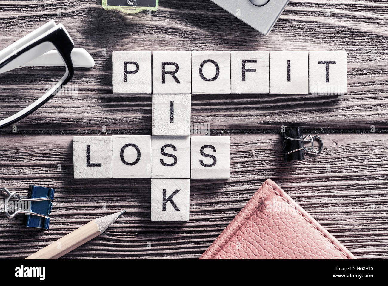 Profit loss and risk words on workplace collected of wooden cube Stock ...
