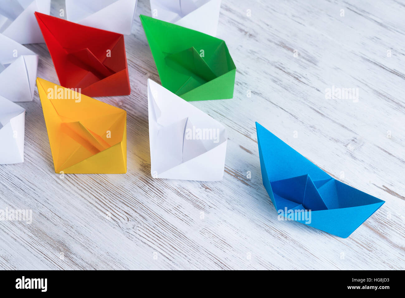 Business leadership concept with white and color paper boats on Stock ...