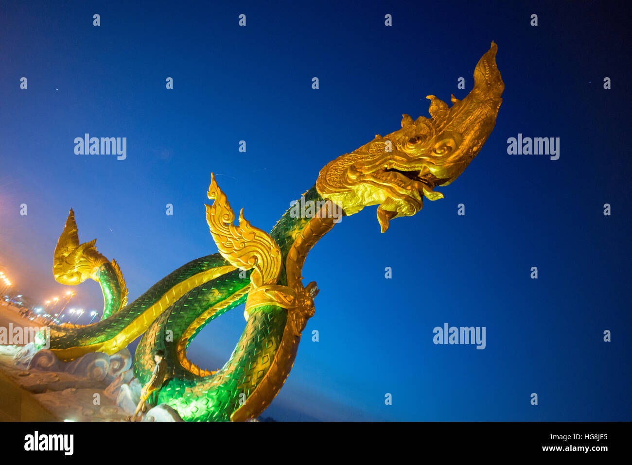 a Phayanak or Naga Statue at the mekong river in the town of Nong Khai ...
