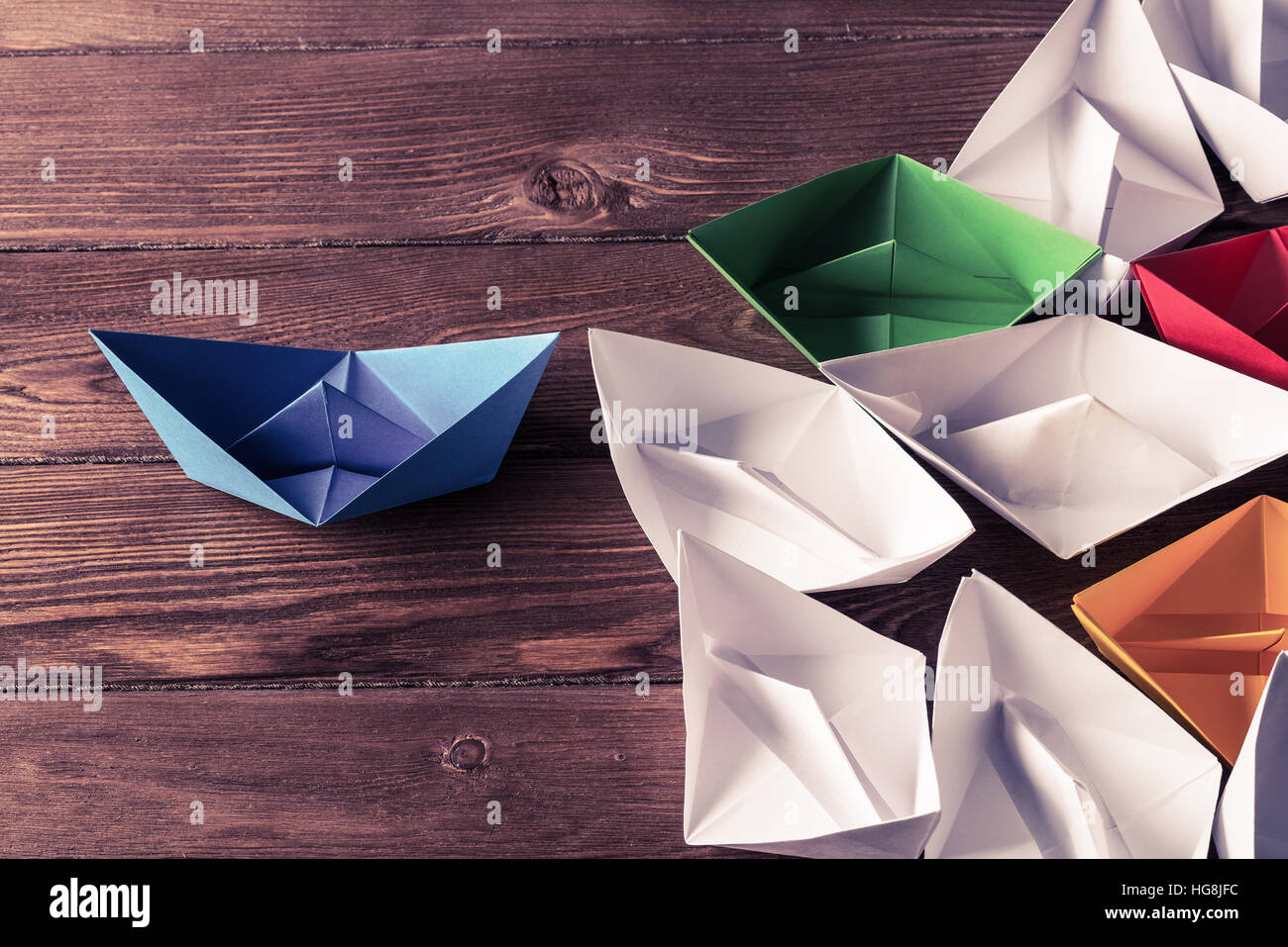 Business leadership concept with white and color paper boats on Stock ...