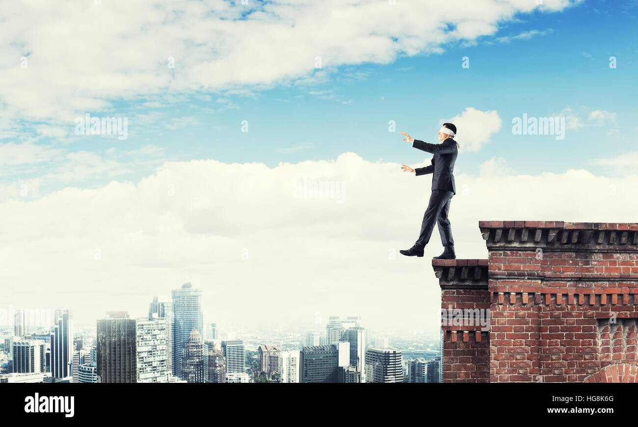 Danger and risk concept with businessman making step from edge Stock ...