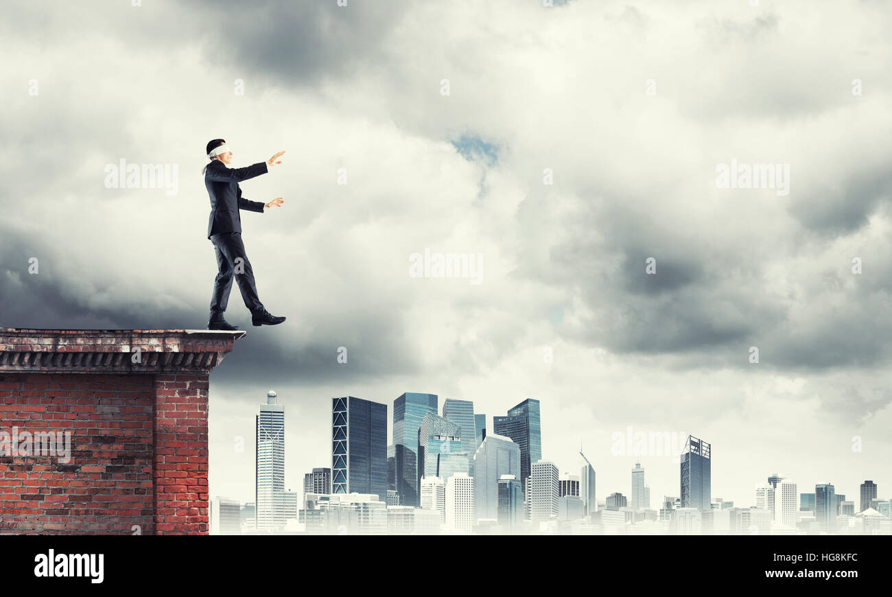 Danger and risk concept with businessman making step from edge Stock ...