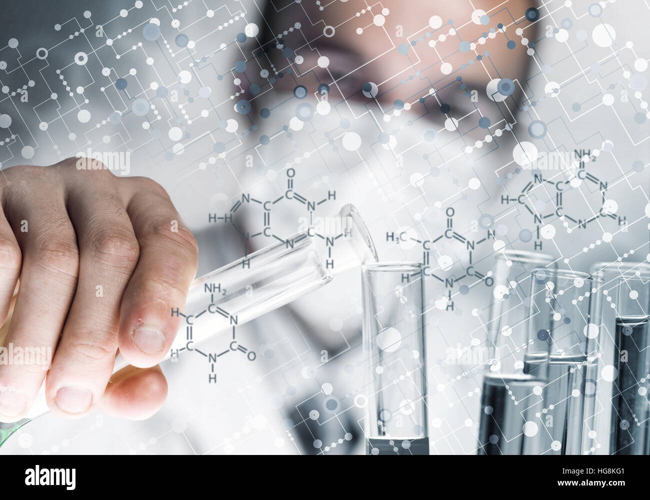 Portrait of concentrated male scientist working with reagents in ...