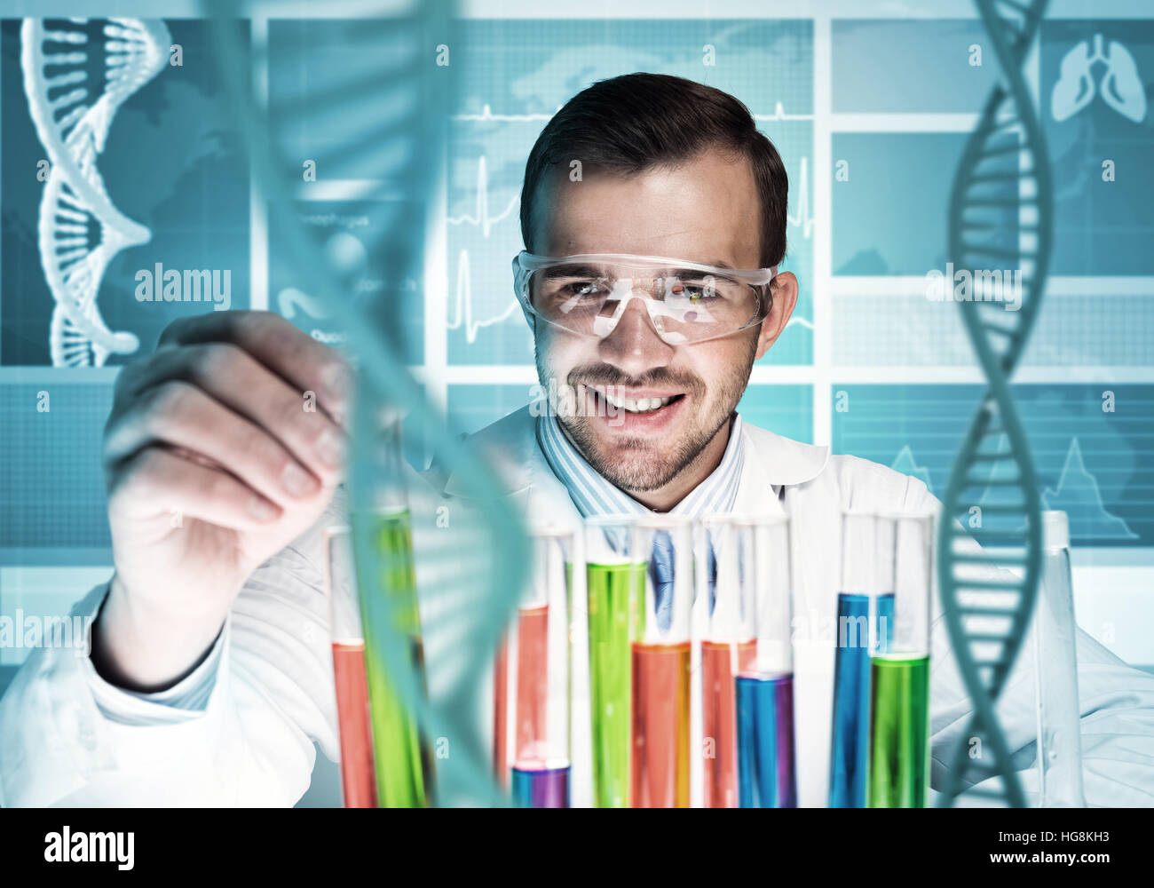 Young scientist mixing reagents in glass flask in clinical laboratory ...