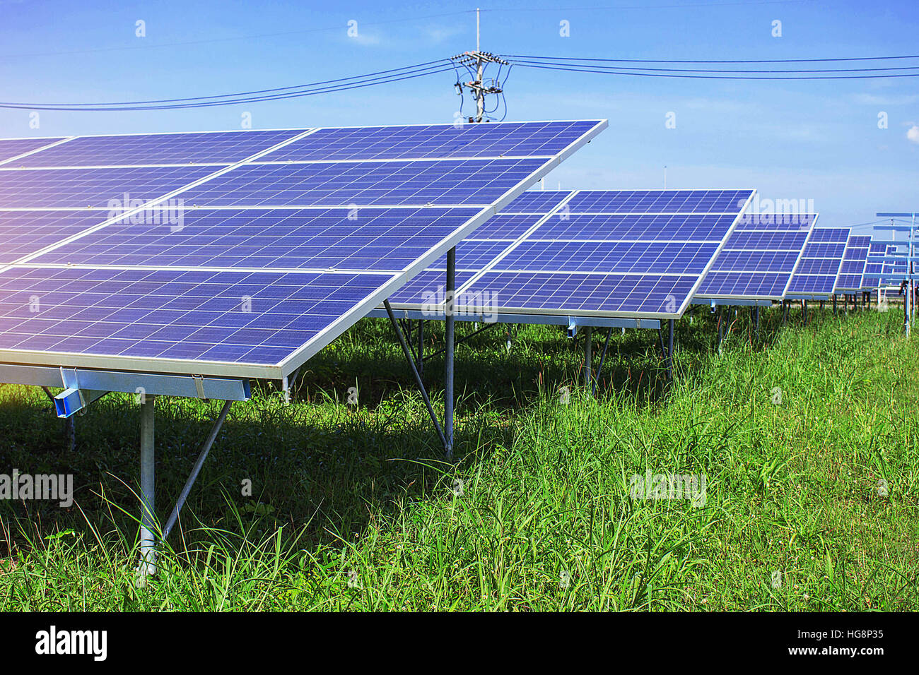 Solar panels on green grass with the sky Stock Photo - Alamy
