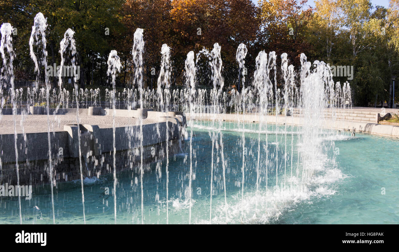 Fountain Splashing Water In The Park Stock Photo - Alamy