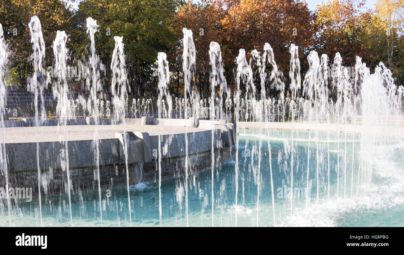 Fountain Splashing Water In The Park Stock Photo - Alamy