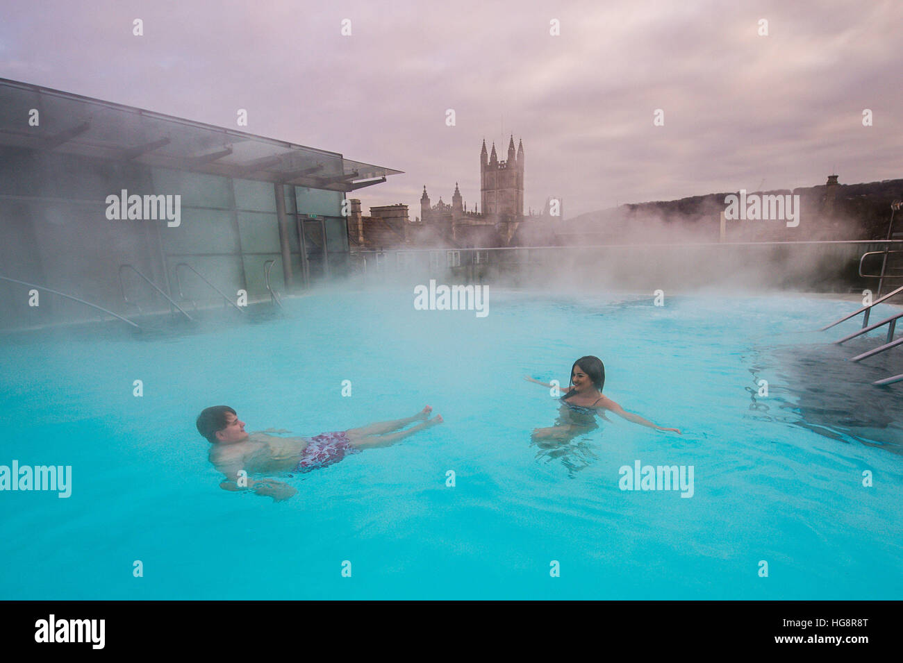 Steam rises above the hot natural spring waters on the rooftop spa at ...