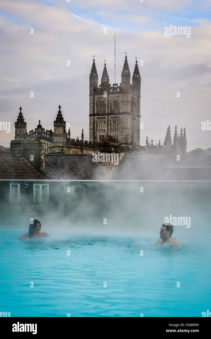 Steam rises above the hot natural spring waters on the rooftop spa at ...