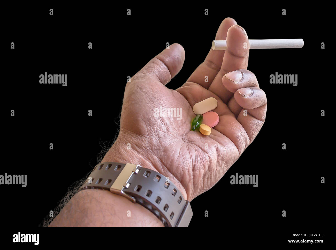 Isolated hand holds cigarette and medicines together - Cigarette ...