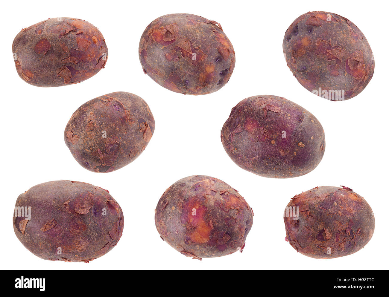 Young raw purple potatoes isolated on white background Stock Photo - Alamy