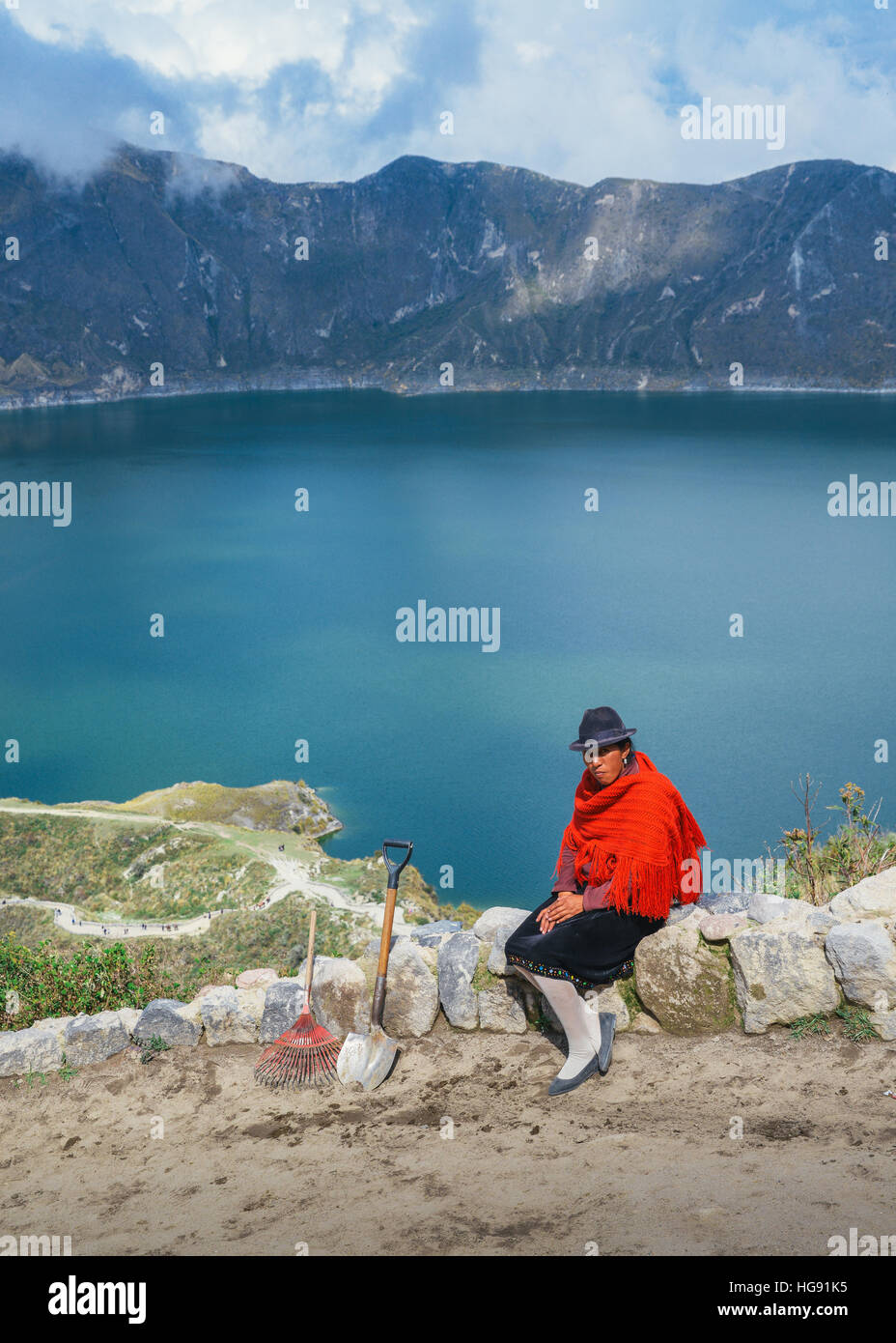 Andean indigenous woman selling textiles in traditional Inca customs in ...