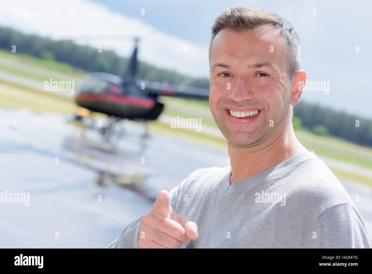 Helicopter pilot smiling hi-res stock photography and images - Alamy