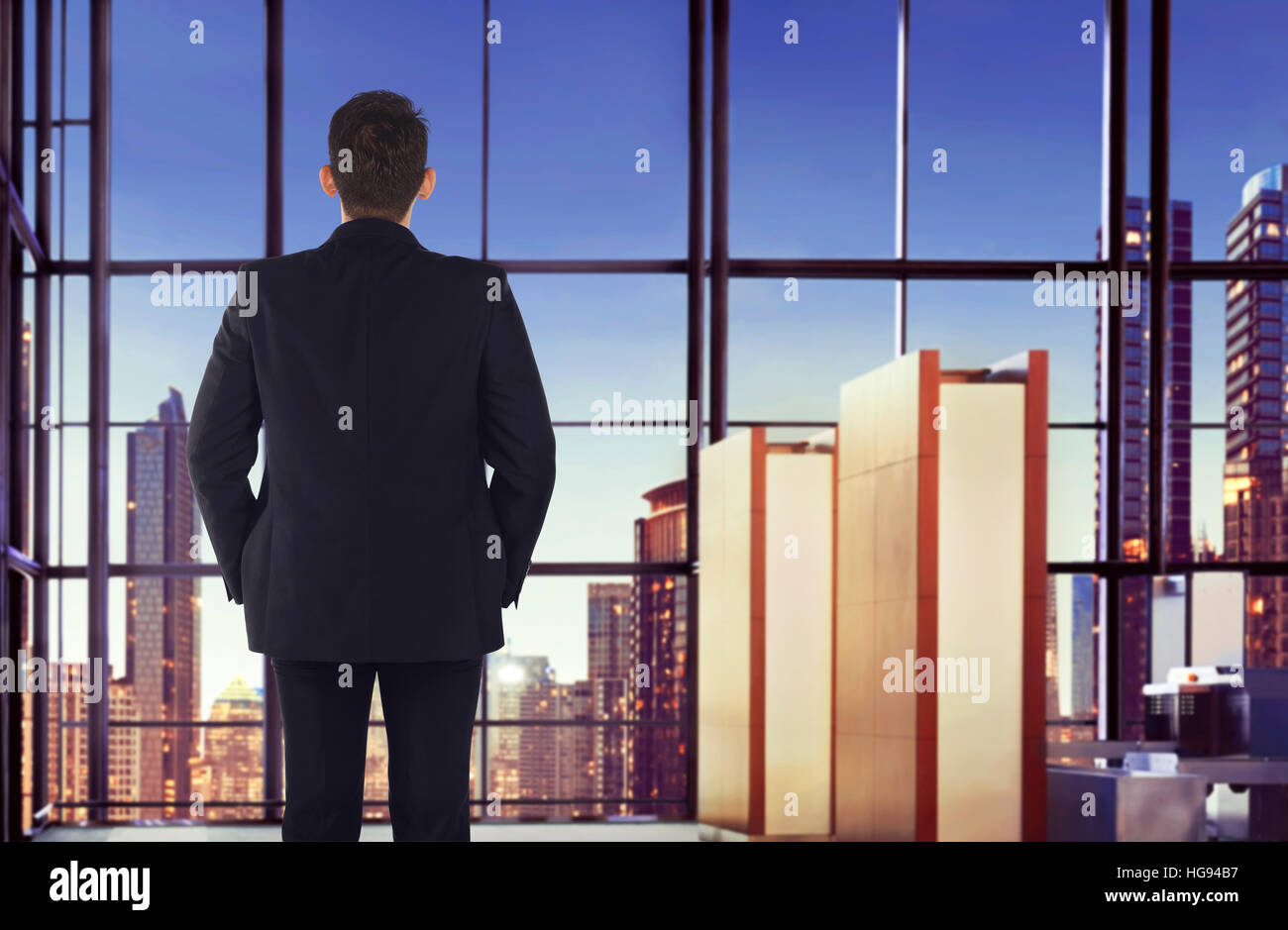 Back view of asian businessman looking cityscape through a window Stock ...