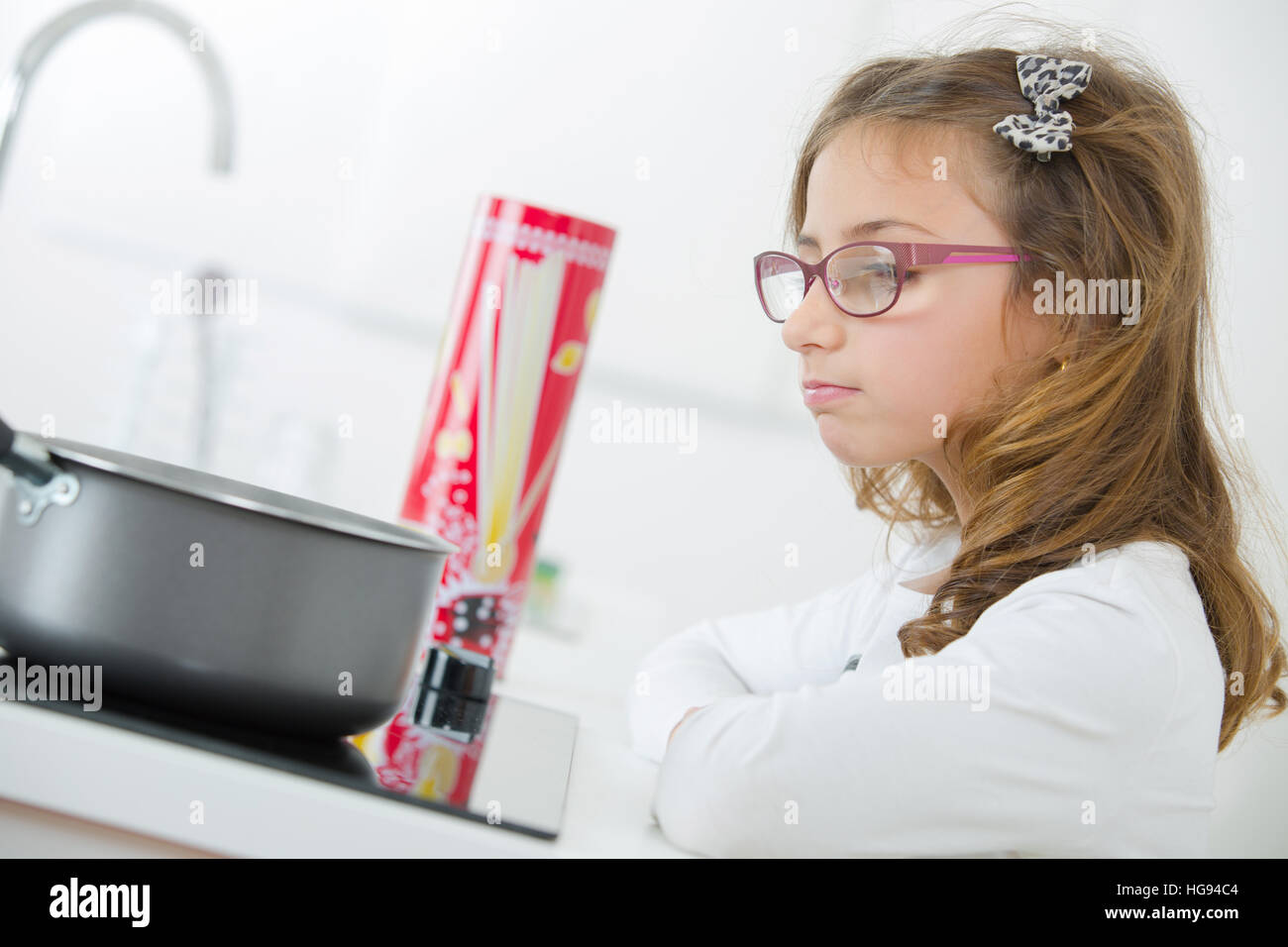Little girl cooking pasta Stock Photo - Alamy