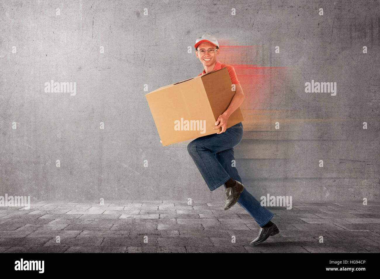 Running asian delivery postman on the city Stock Photo - Alamy