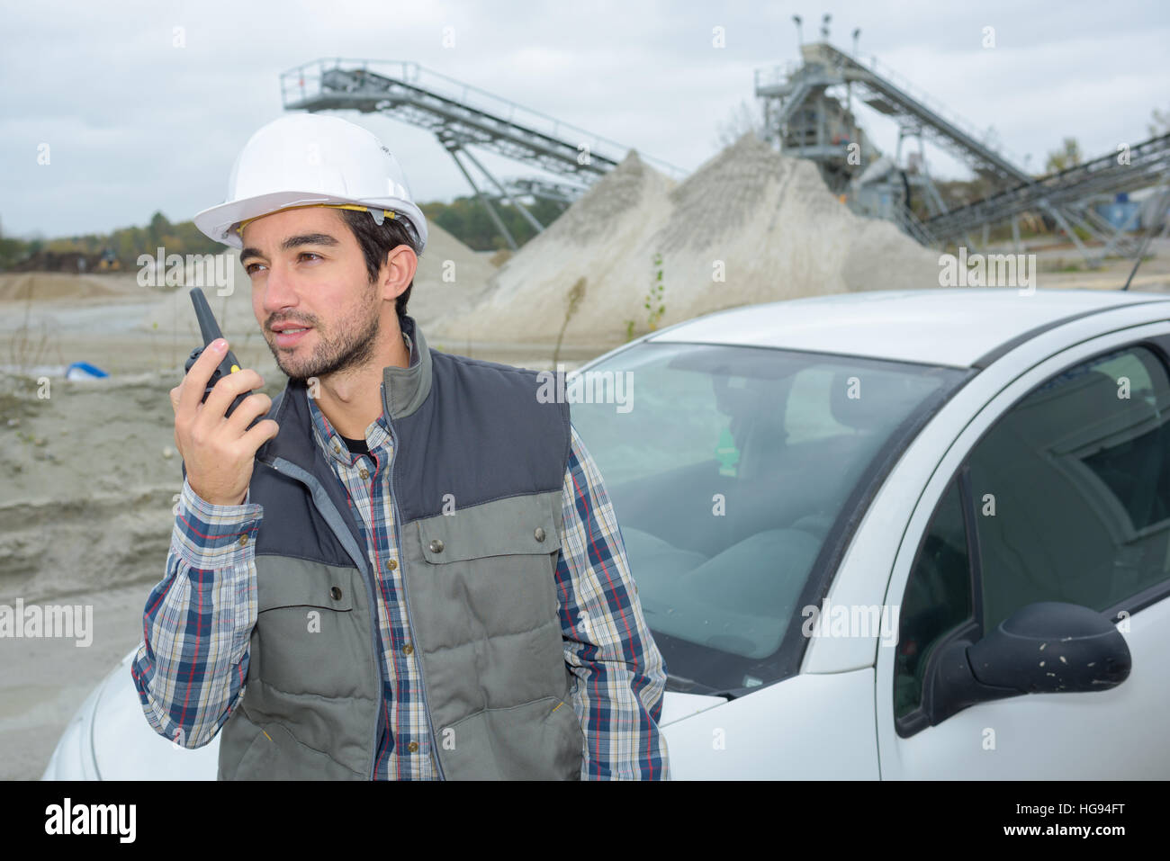 Man using walkie talkie Stock Photo - Alamy