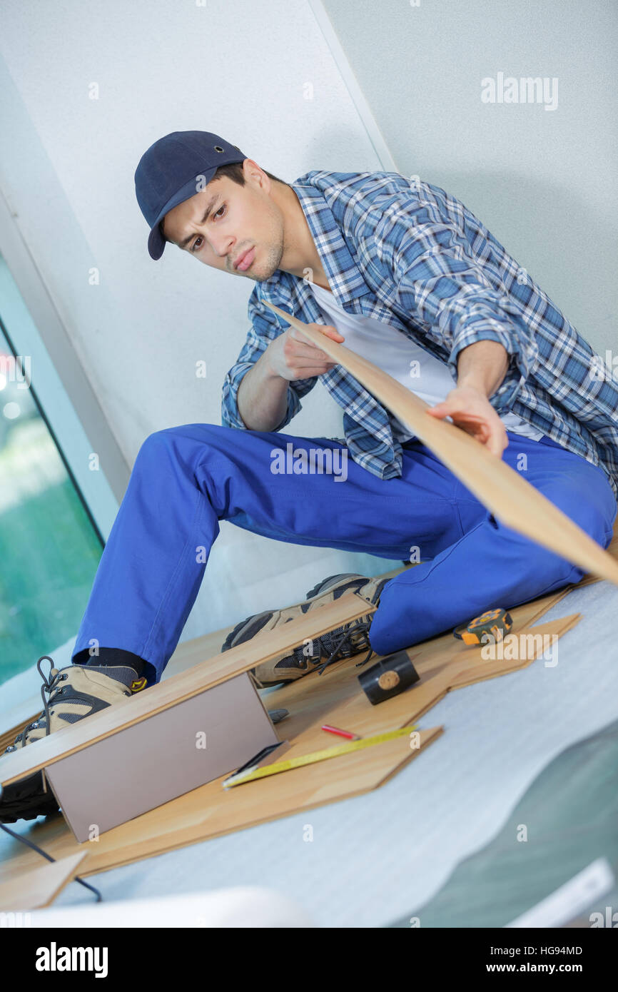 young handyman in uniform Stock Photo - Alamy
