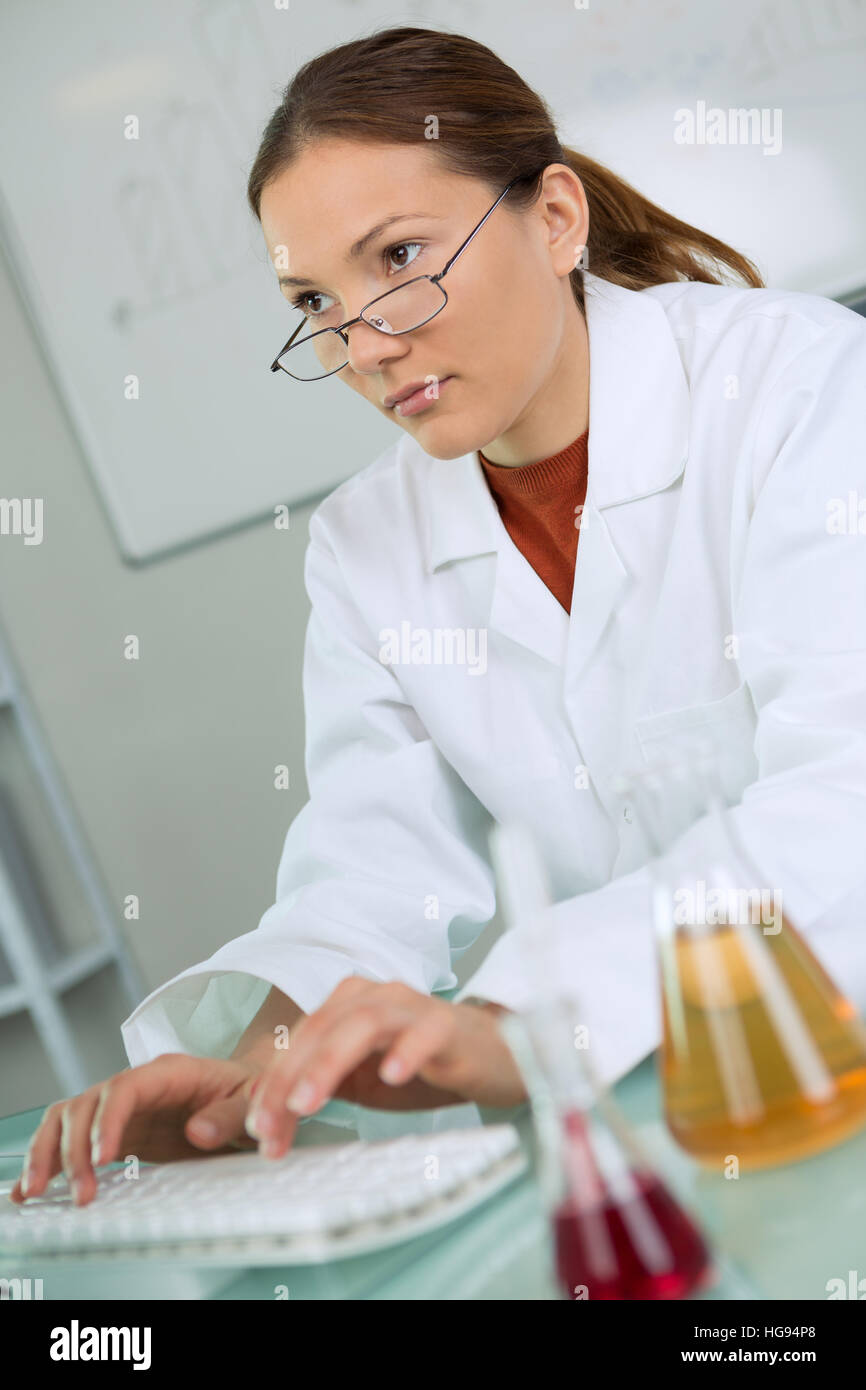 young female scientist working with liquids in laboratory Stock Photo ...