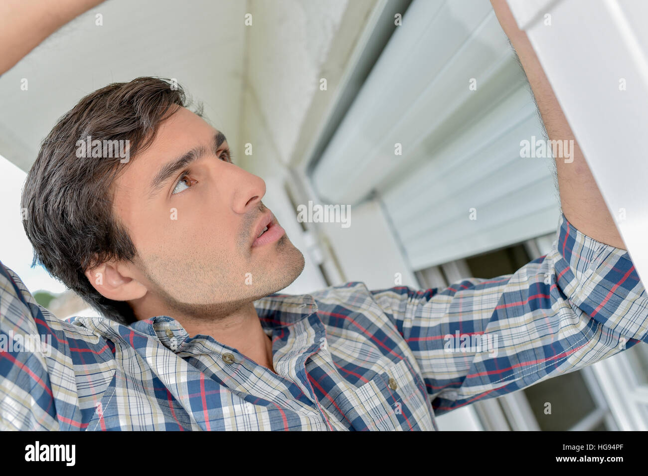 Installing a window Stock Photo - Alamy