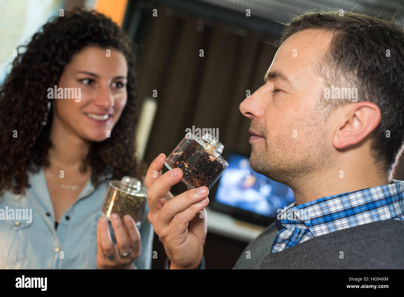 Man smelling fragrances Stock Photo - Alamy