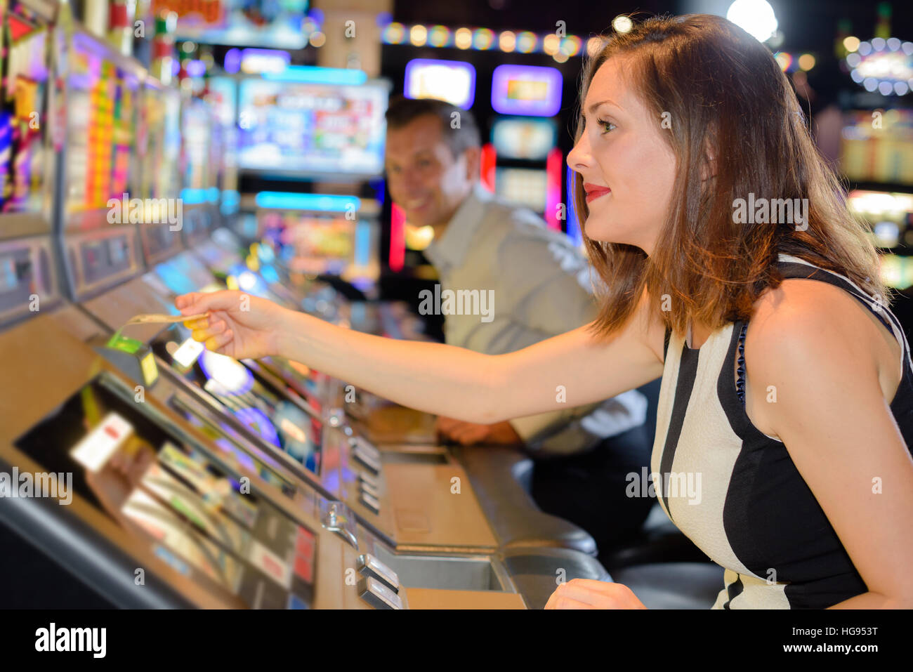 pulling the slot machine ticket Stock Photo - Alamy