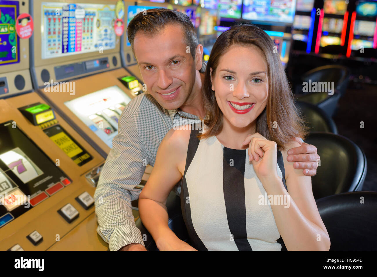 posing next to slot machine Stock Photo - Alamy