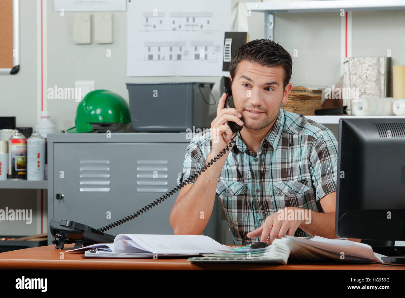 Office worker on the phone to his client Stock Photo - Alamy