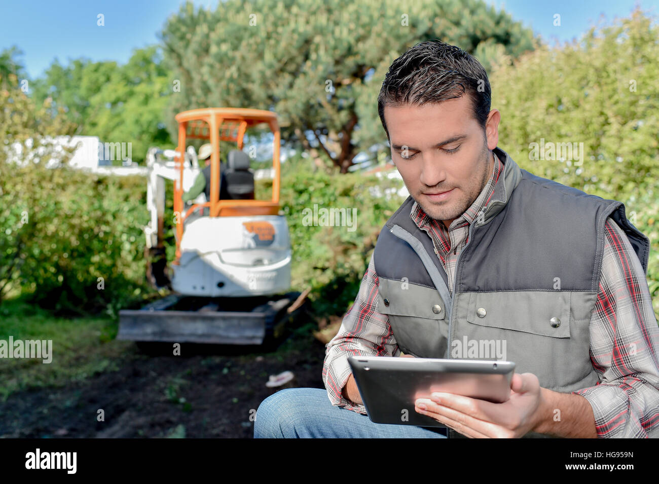 Man sitting on digger hi-res stock photography and images - Alamy