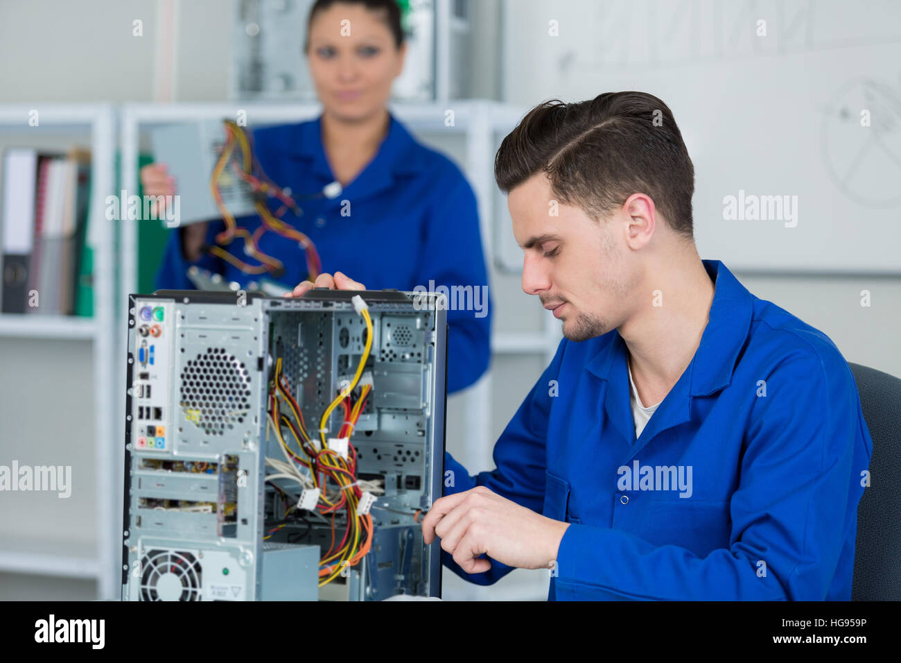 team of students examining and repairing computer parts Stock Photo - Alamy