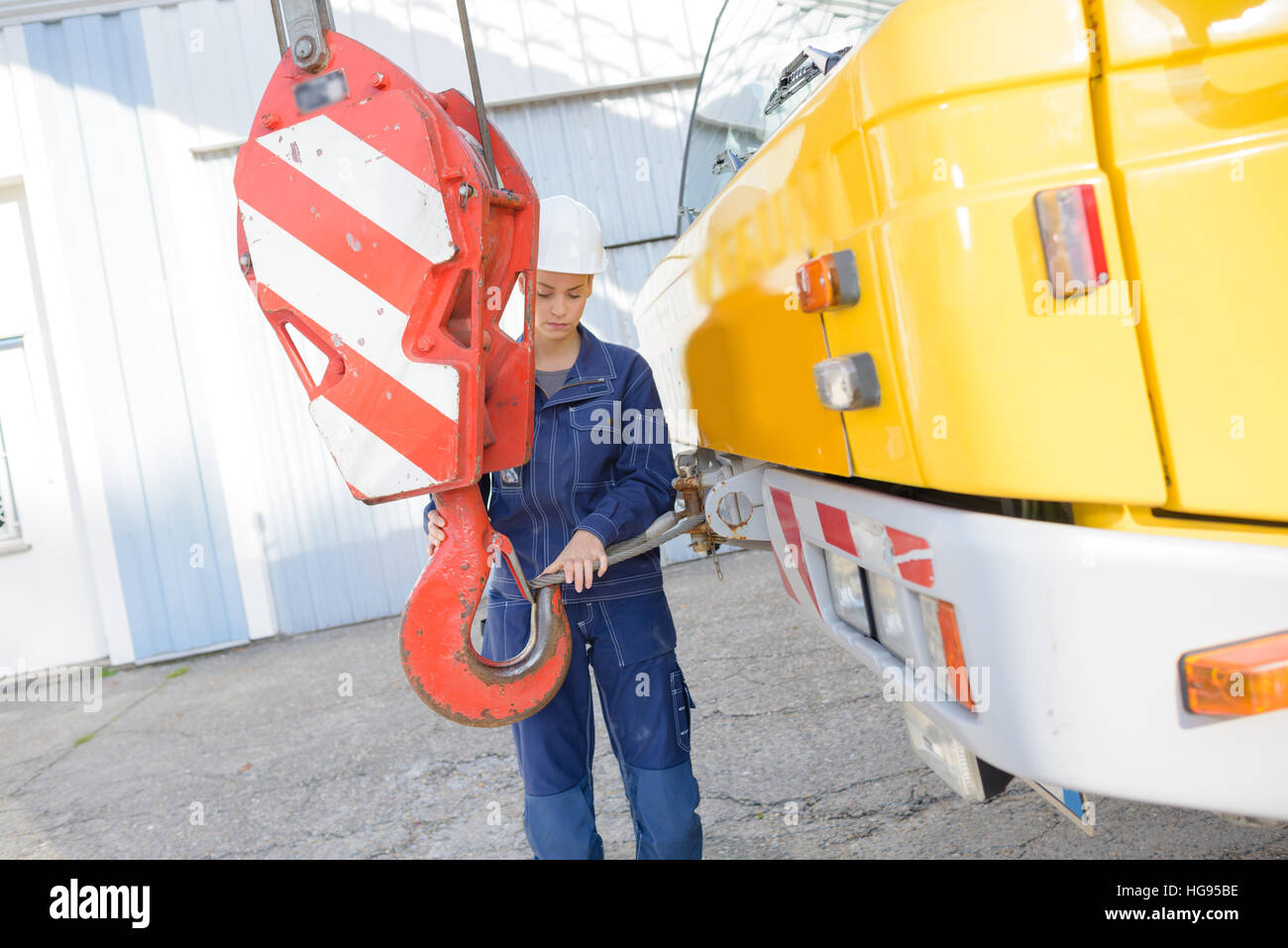 female worker checking on the hook Stock Photo - Alamy