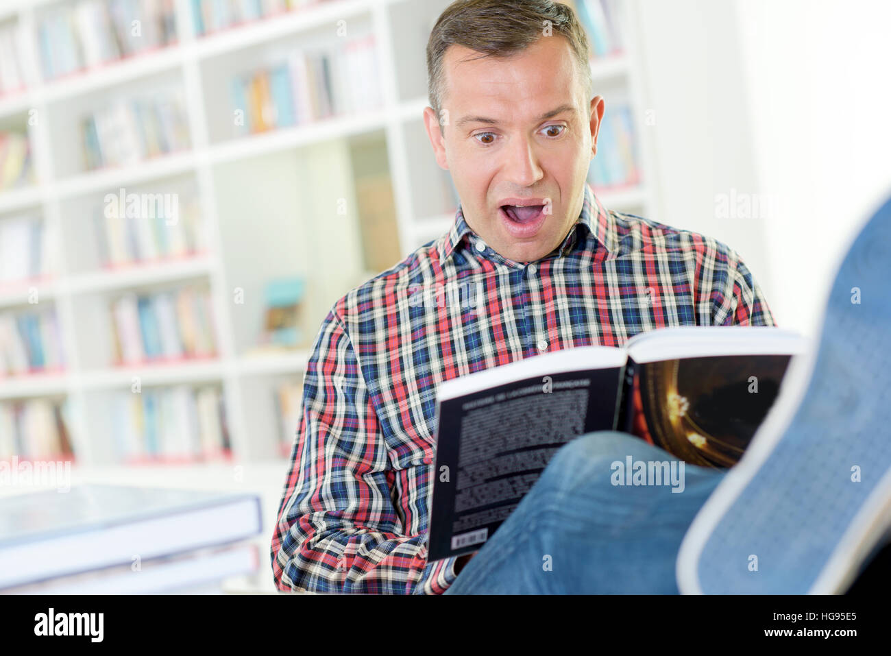 Shock reading book hi-res stock photography and images - Alamy