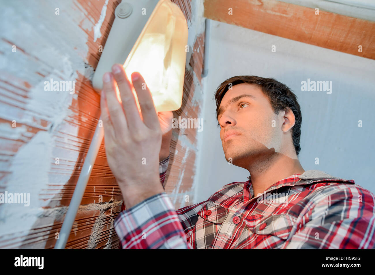 DIY enthusiast installing a light Stock Photo - Alamy