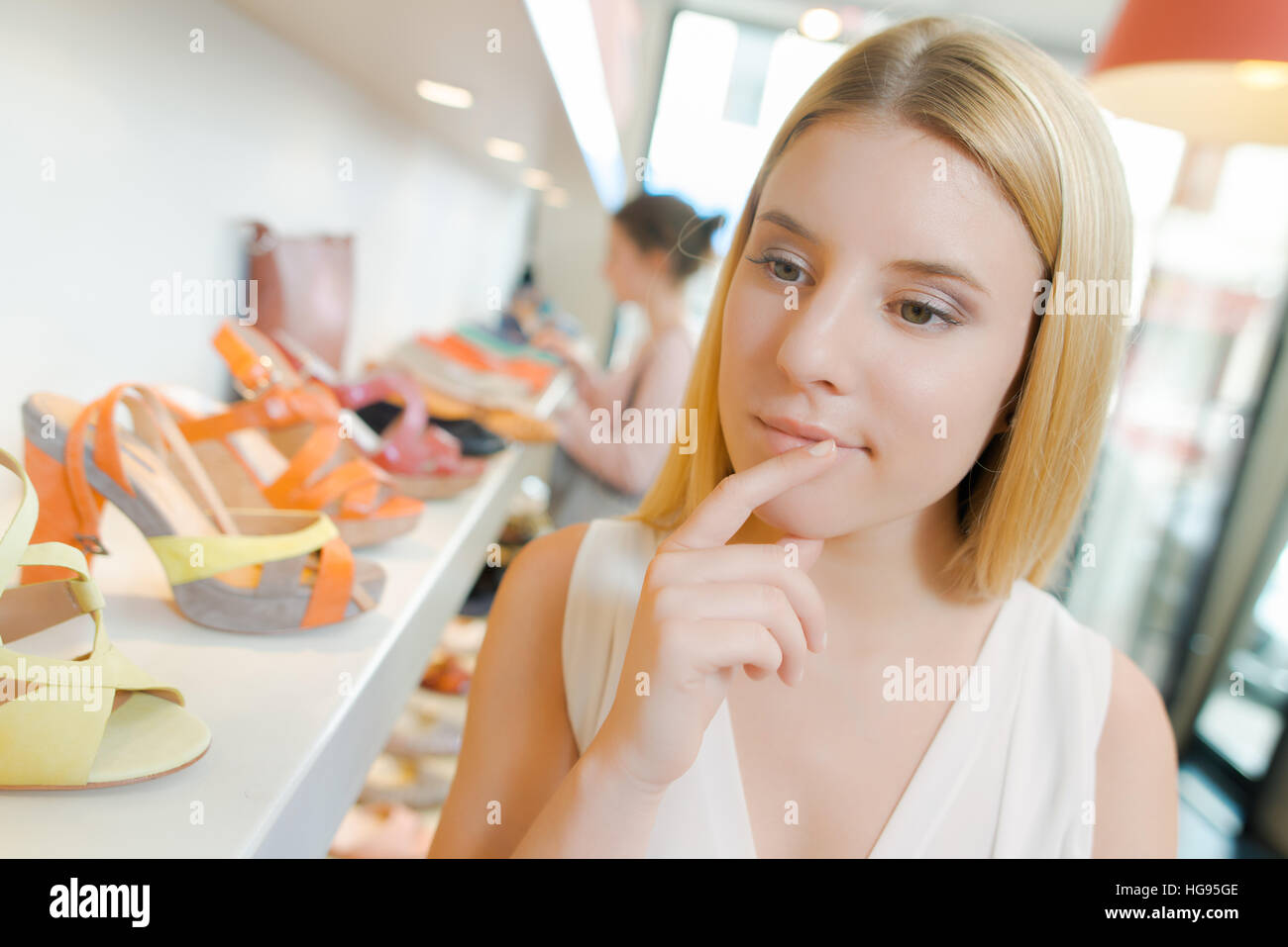 Trying to choose shoes Stock Photo - Alamy